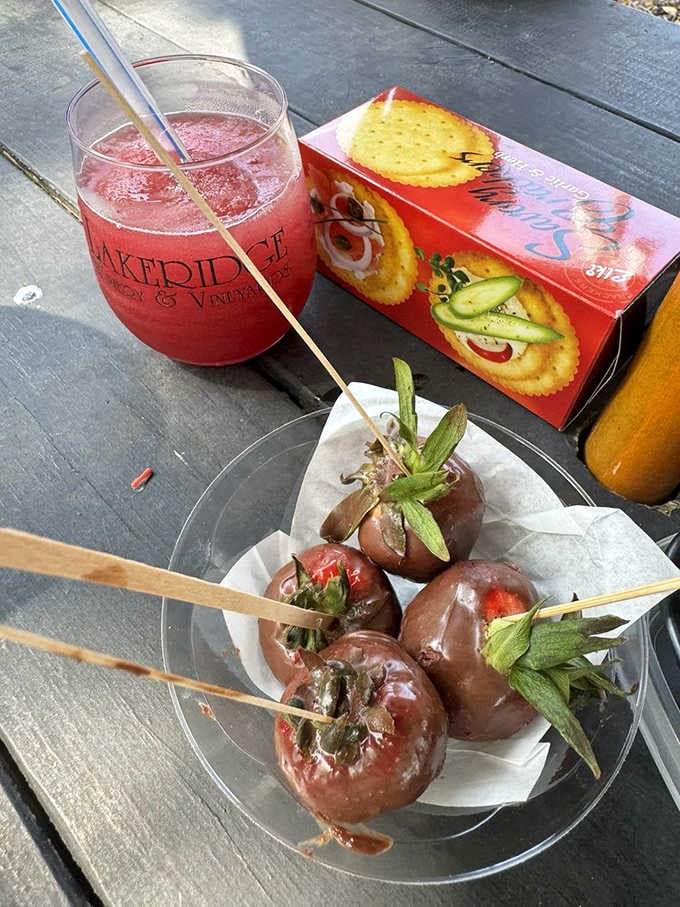 Chocolate-dipped strawberries on a stick next to a Lakeridge wine slushie is a combination nobody asked for but everyone needs.