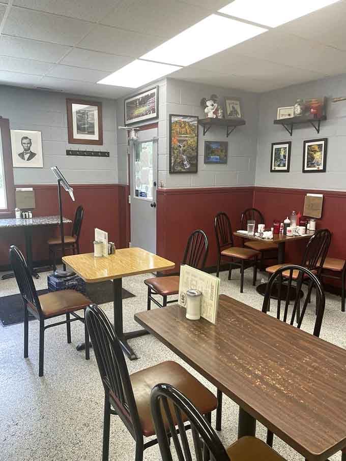 Framed photos, warm wainscoting, and mismatched charm, this dining room has more personality than most places three times its size.