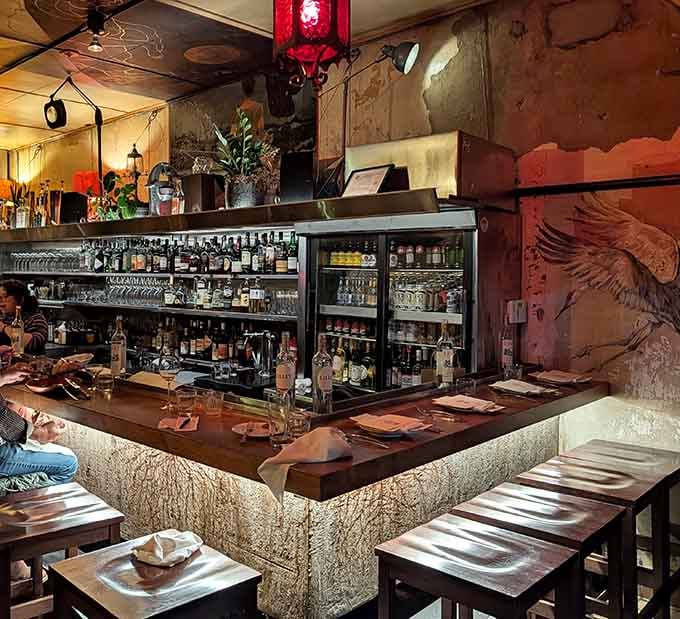 The bar area where bottles line up like soldiers and the bartenders know their craft inside and out.