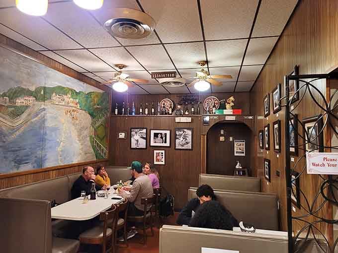 Happy diners surrounded by murals and framed photos at Mama Santa's, this is what a neighborhood restaurant looks like.