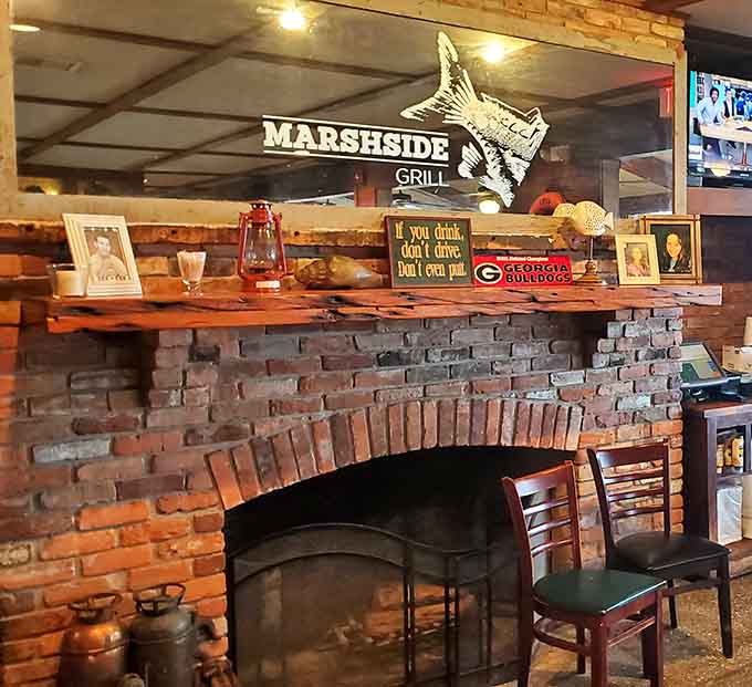 A brick fireplace with a Georgia Bulldogs sign on the mantle. This place knows exactly who it is.