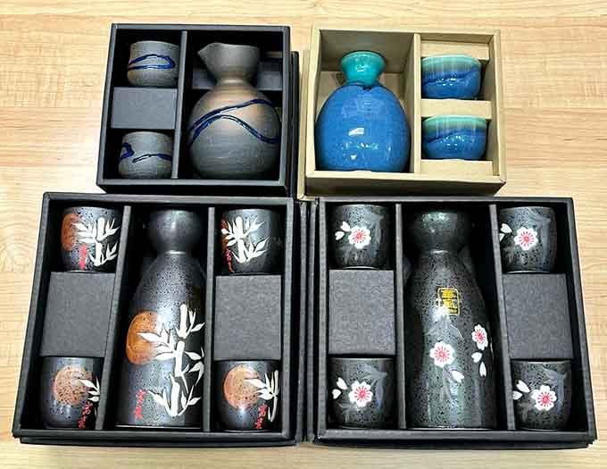 Beautifully boxed sake sets with cherry blossoms and bamboo designs, the gift that says you actually tried.