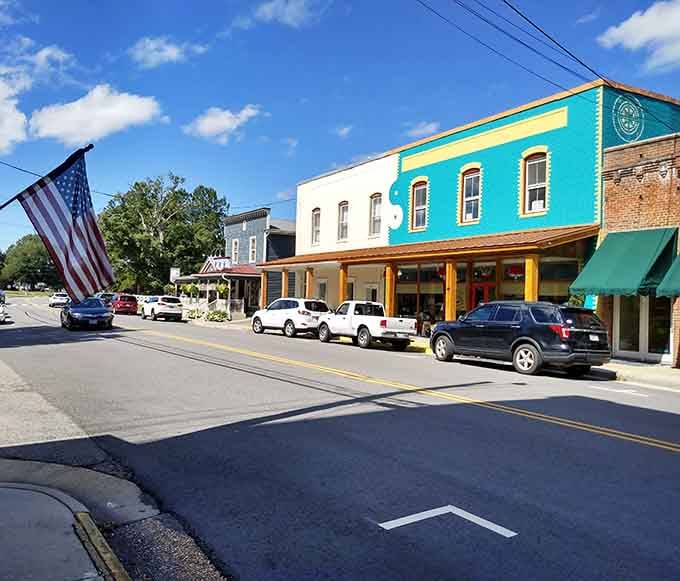 A flag, a teal storefront, and a street that somehow manages to feel both lively and completely unhurried at the same time.