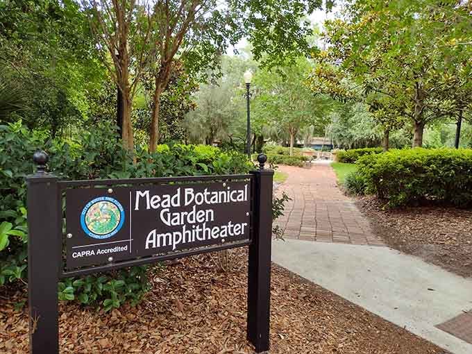 A sign that actually delivers on its promise, because yes, there really is an amphitheater down that pretty brick path.