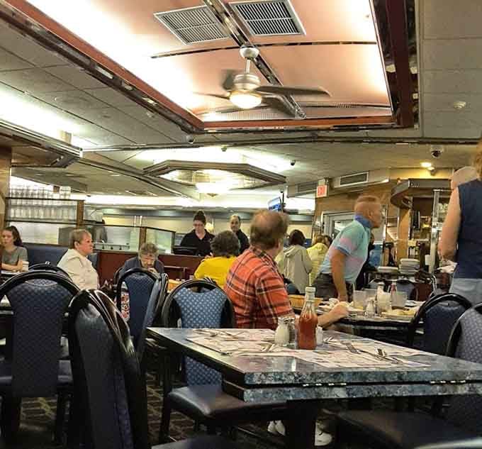 A full house of happy diners, buzzing servers, and the kind of energy that only real neighborhood spots produce.