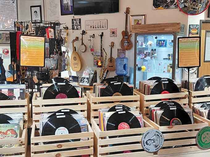 Guitars on the wall, records in the crates, and a screen playing Bronski Beat. This vendor means serious business.