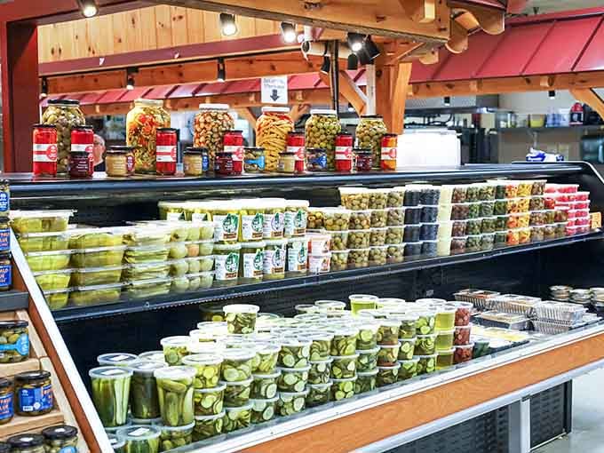 Rows of pickles, olives, and preserved goods. This display has more personality than most restaurants.