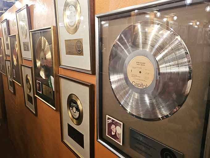 A wall of gold and platinum records, including a Bob Seger platinum album. This hallway is basically a greatest hits collection.