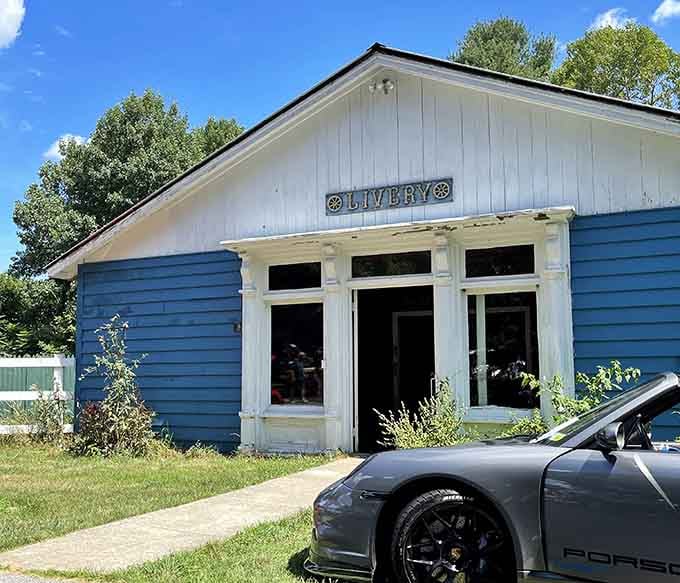 The Livery building stands quietly next to a modern Porsche, which is honestly the funniest contrast you'll see all day.