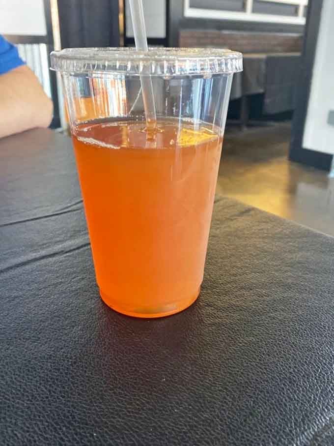 That bright orange Kool-Aid sitting on the table is basically sunshine in a cup, and nobody is complaining.