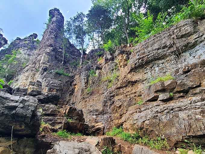 Getting up close reveals the layered limestone texture, each stripe representing eons of history you can actually touch.