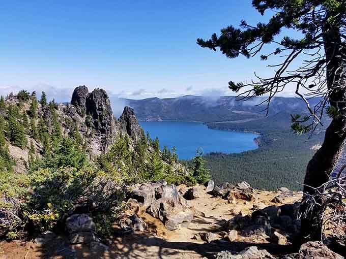 Jagged volcanic spires frame Paulina Lake's brilliant blue water, a composition that no landscape painter could improve upon.
