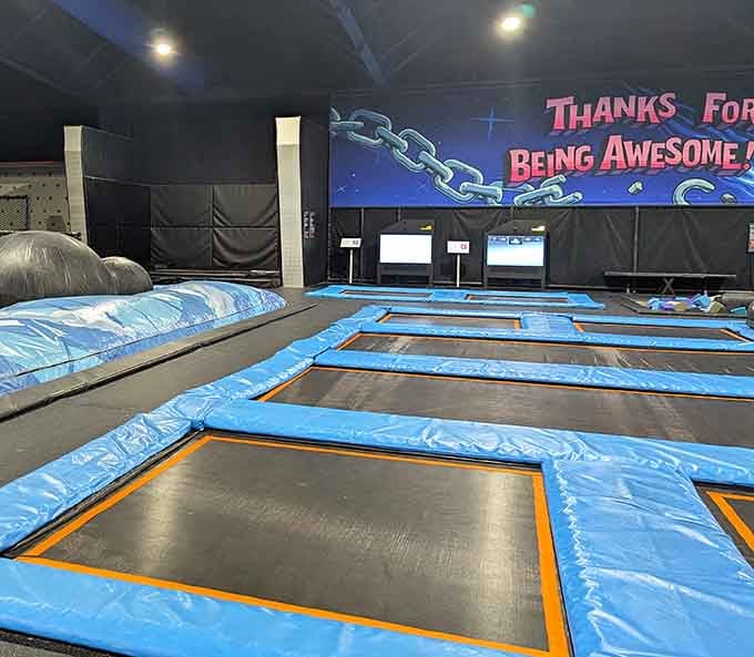 Rows of trampolines lined up and ready, with a "Thanks For Being Awesome" mural cheering you on from the wall.