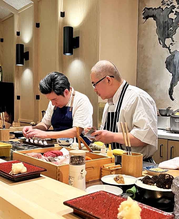 Two chefs working in focused silence, surrounded by beautiful ingredients, remind you that real craft never needs to announce itself loudly.