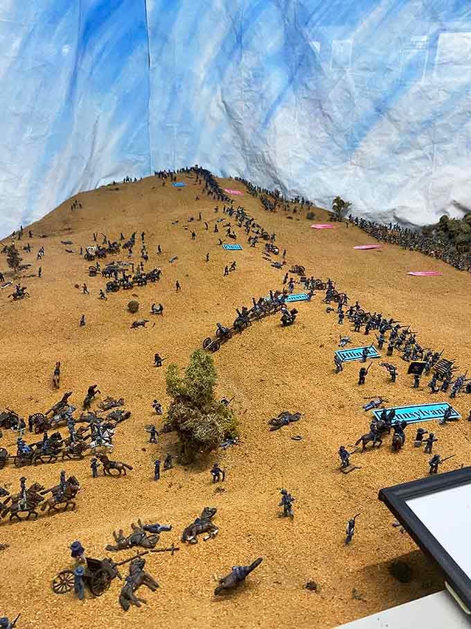 A miniature battlefield diorama so detailed, you'll lean in closer than you planned and stay much longer.
