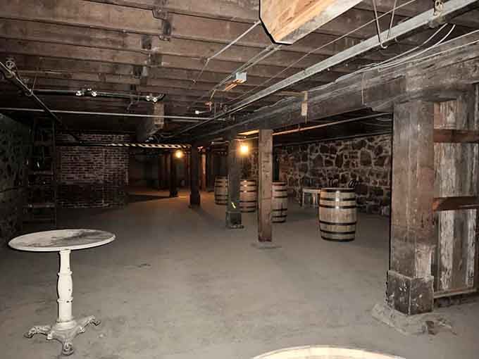 Stone walls, wooden barrels, and dim light stretching into the dark. The Shanghai Tunnels look exactly as mysterious as they sound.