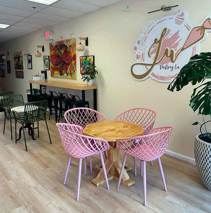 Pink chairs at wooden tables create an Instagram moment that's almost too pretty for actual sitting.