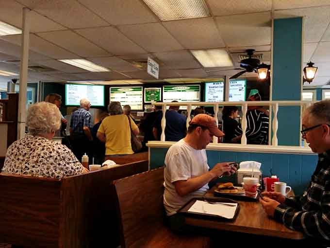 A full house at the counter and happy diners in the booths. This is what a genuinely beloved neighborhood restaurant looks like on any given day.