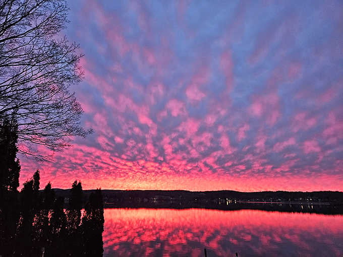 When the sky over Pontoosuc Lake turns hot pink and deep purple at sunset, even your phone camera can't believe its luck.