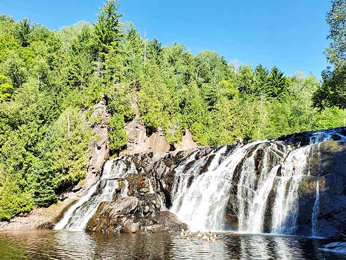 On a clear blue sky day, the falls and their pool look almost too beautiful to be real.