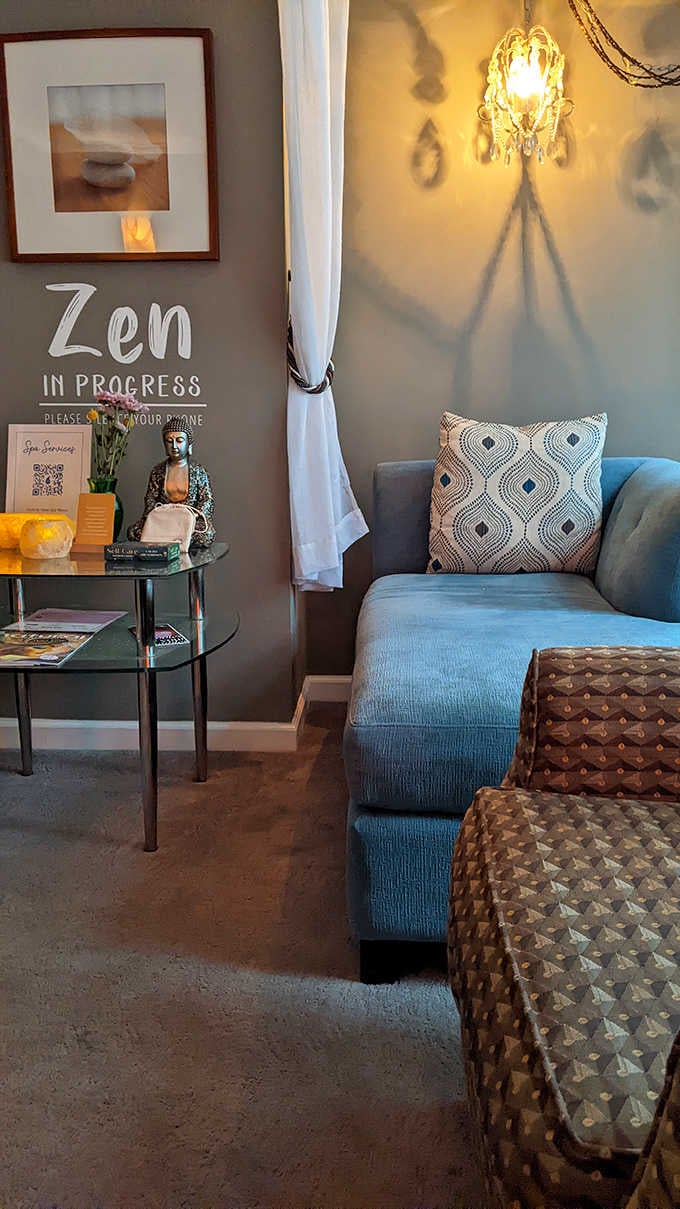 Buddha statue and cozy seating prove that zen happens before your treatment even starts here.