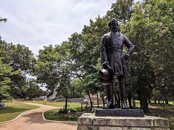 This bronze figure standing tall in Salado's park looks like he's been waiting for you to finally show up.
