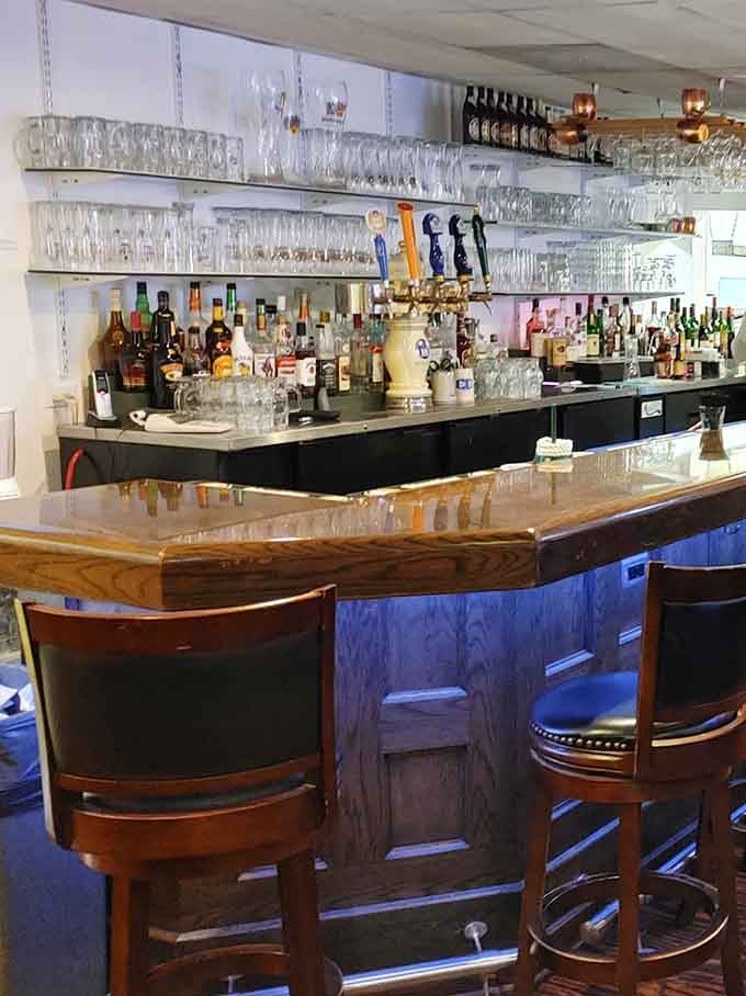 A well-stocked bar with rows of glassware and draft taps ready. The kind of bar that takes its beer as seriously as its food.