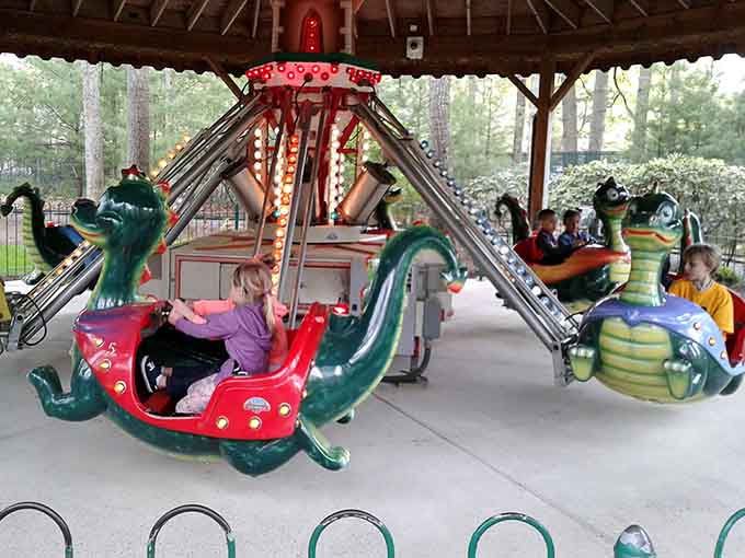 Swooping dragon cars spin under a covered pavilion, making the Happy Dragon ride a perfect choice rain or shine.