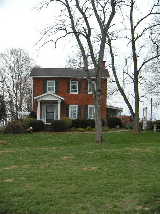 The classic brick farmhouse stands as a testament to Indiana's agricultural heritage and enduring charm.