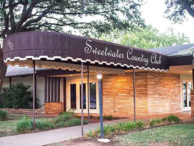 The country club entrance welcomes members to a community hub where friendships form over meals and shared experiences.