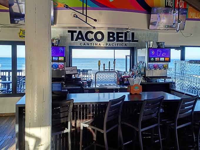 The Taco Bell Cantina Pacifica bar, where draft taps and an ocean view share the same frame without any irony.