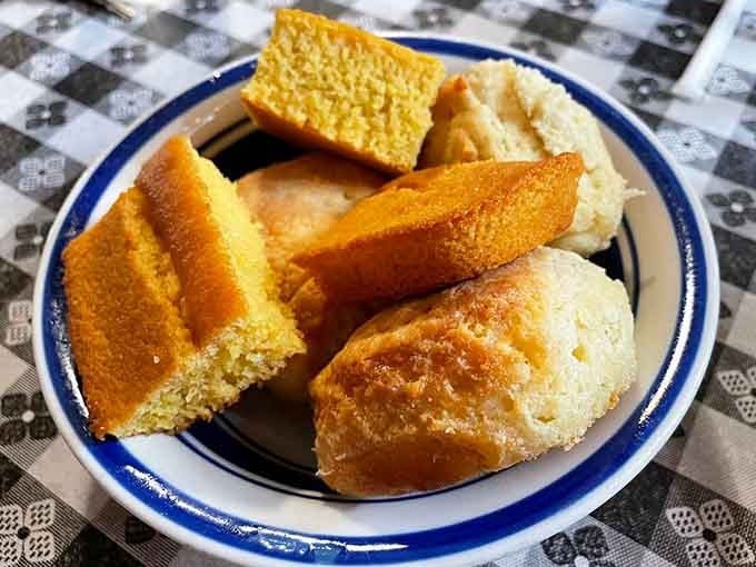 A basket of cornbread and biscuits that arrives at the table and immediately makes everything feel right with the world.