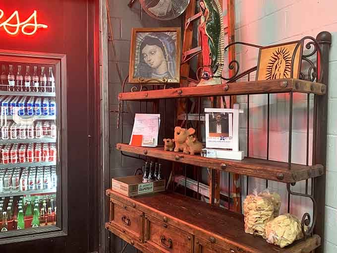 Religious icons, ceramic figurines, and warm wooden shelves. This corner has more soul than most restaurants have altogether.