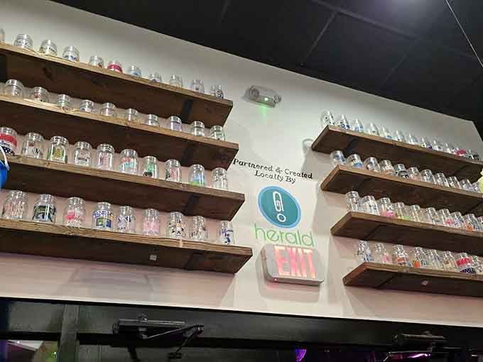 Rows of decorated mason jars on the wall, each one a tiny trophy from someone's very good day.