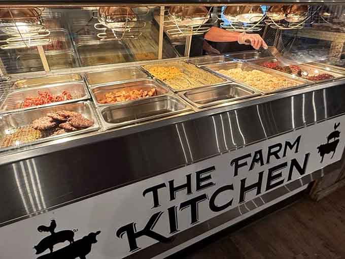 The hot food buffet station where breakfast items wait patiently to make your morning absolutely spectacular.