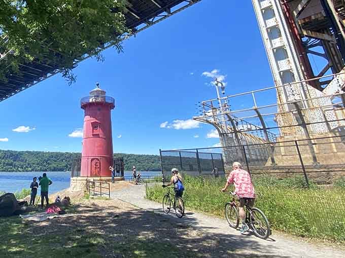 Cyclists, joggers, and curious wanderers all find their way here, drawn by the river and that unmistakable red tower.