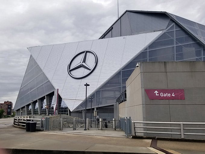 Mercedes-Benz Stadium looms large and dramatic, a modern marvel that looks like it landed from another dimension entirely.