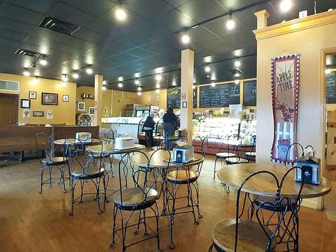 Warm walls, wrought iron chairs, and a display case full of reasons to cancel your dinner plans.