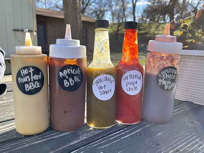 Homemade sauces lined up like soldiers, each one ready to take your barbecue experience to new heights.