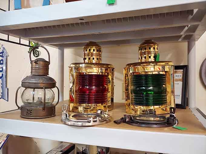 Polished brass marine lanterns glowing red and green, Old Saybrook's coastal soul showing up right on the shelf.
