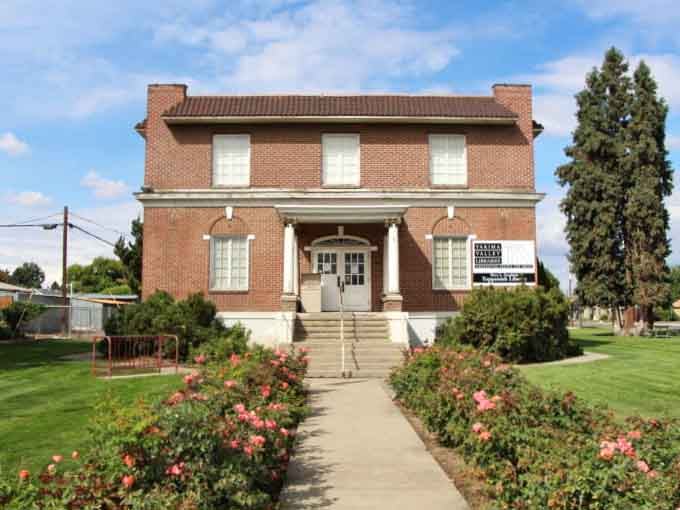 The Mary L. Goodrich Community Library sits behind a garden of roses, proof that small towns do things right.