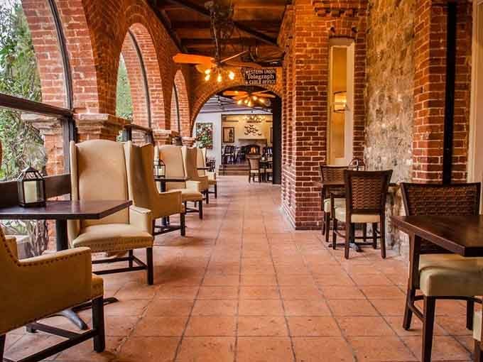 Red brick arches, terracotta floors, and a vintage Western Union sign. History and hospitality sharing the same beautiful, unhurried space.