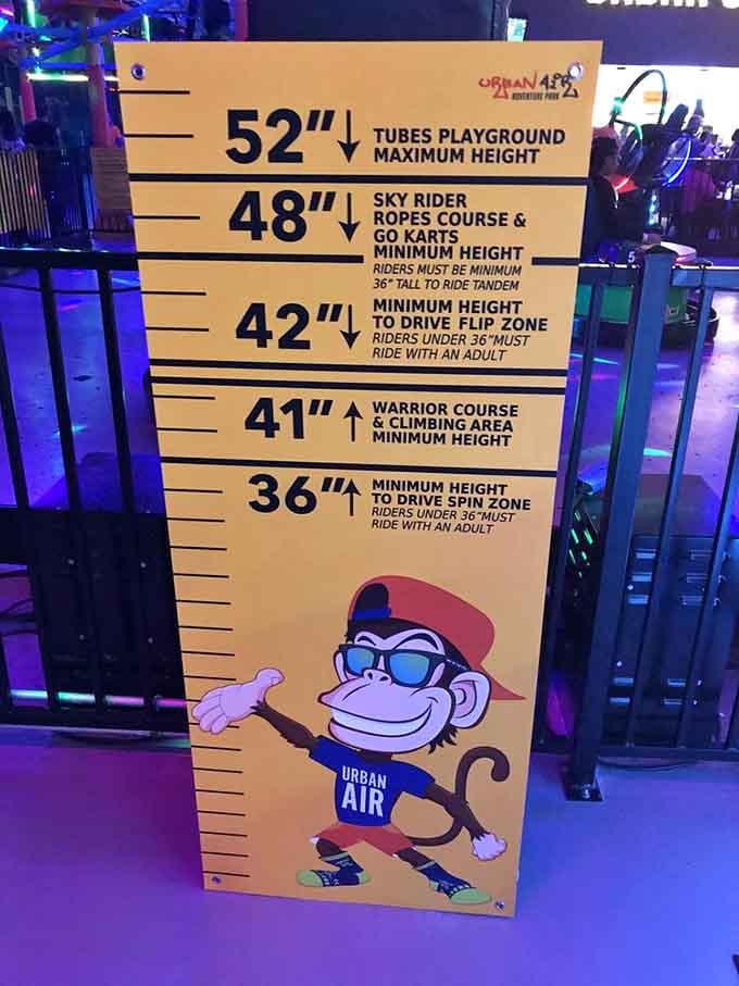 The height chart at Urban Air is refreshingly honest, it tells you exactly where the fun begins for everyone.