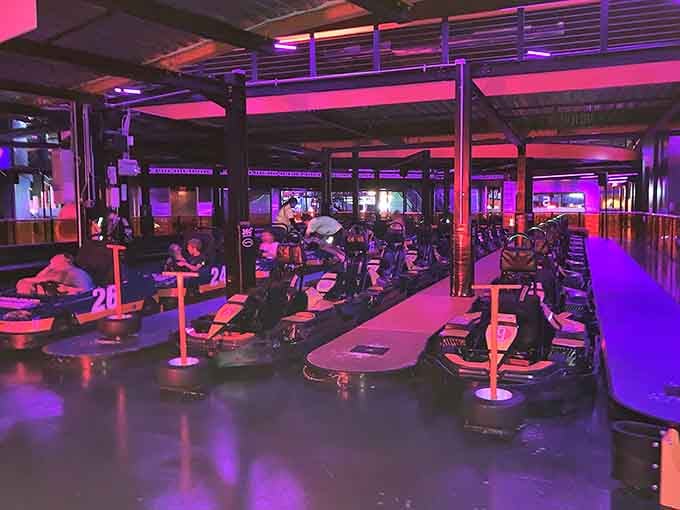Purple-lit karts lined up and ready. The only question is whether you can handle the competition.