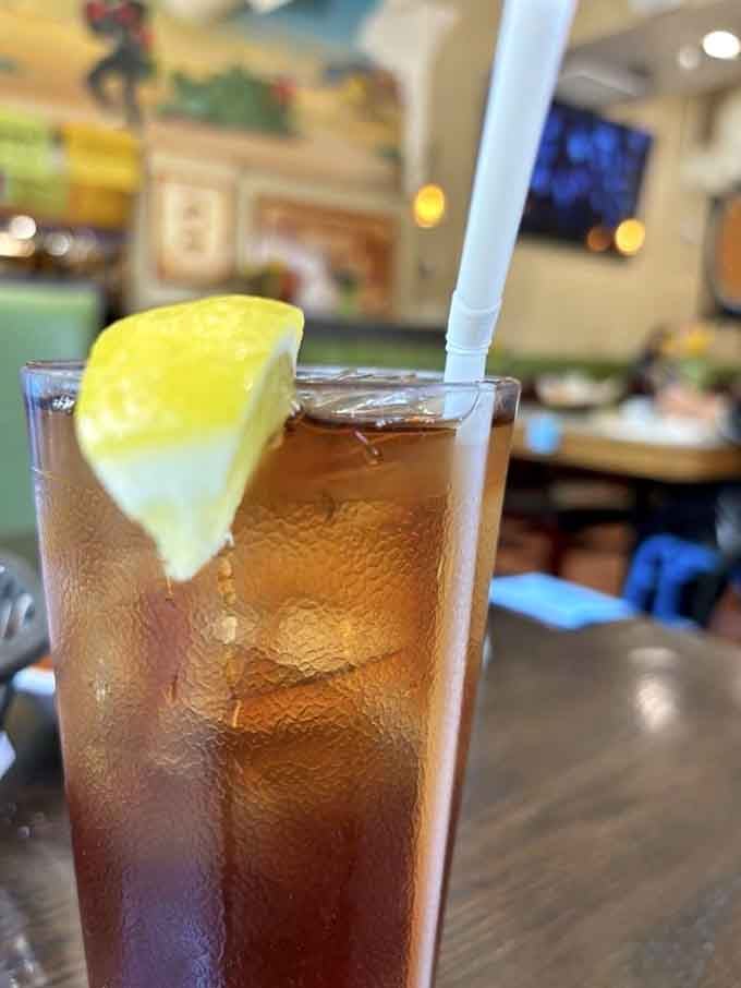 A tall iced tea with a lemon wedge: the universal signal that lunch is about to get very good.