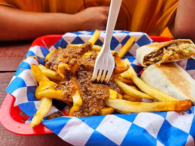 Chili cheese fries that demand your full attention. Fork in hand, no distractions, just pure, unapologetic indulgence.