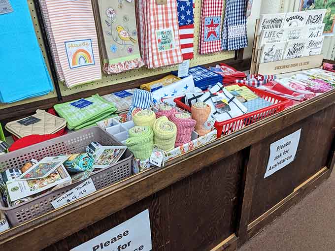 Cheerful kitchen towels and dish cloths folded so invitingly, you'll suddenly feel inspired to actually enjoy doing the dishes.