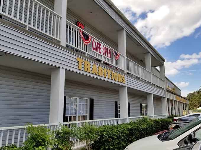 Traditions Antique Mall, where the cafe sign upstairs is basically the universe telling you to stay longer.