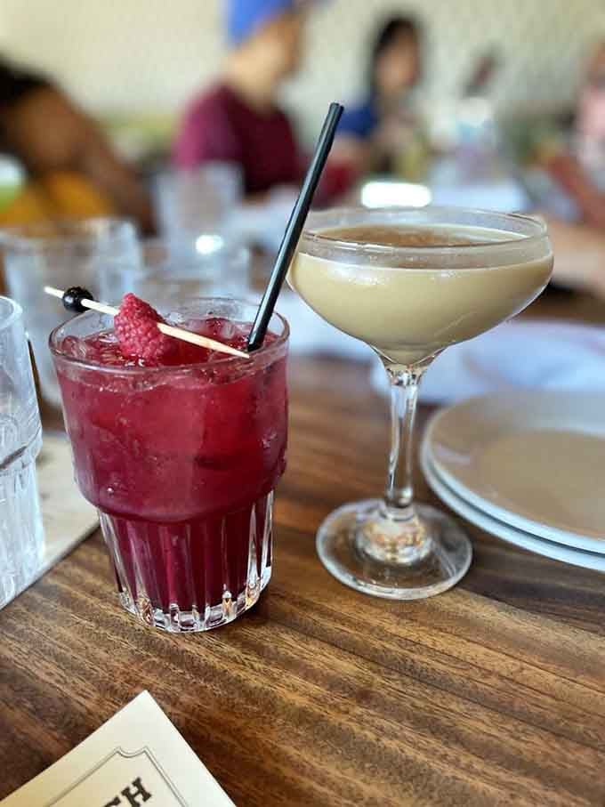 Two cocktails side by side, one berry-bright and one creamy smooth. Windsor's drink menu deserves its own fan club.