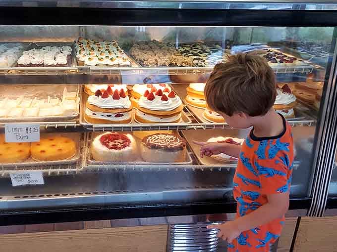 That look of pure concentration says it all, choosing from this display case is the most important decision of the day.